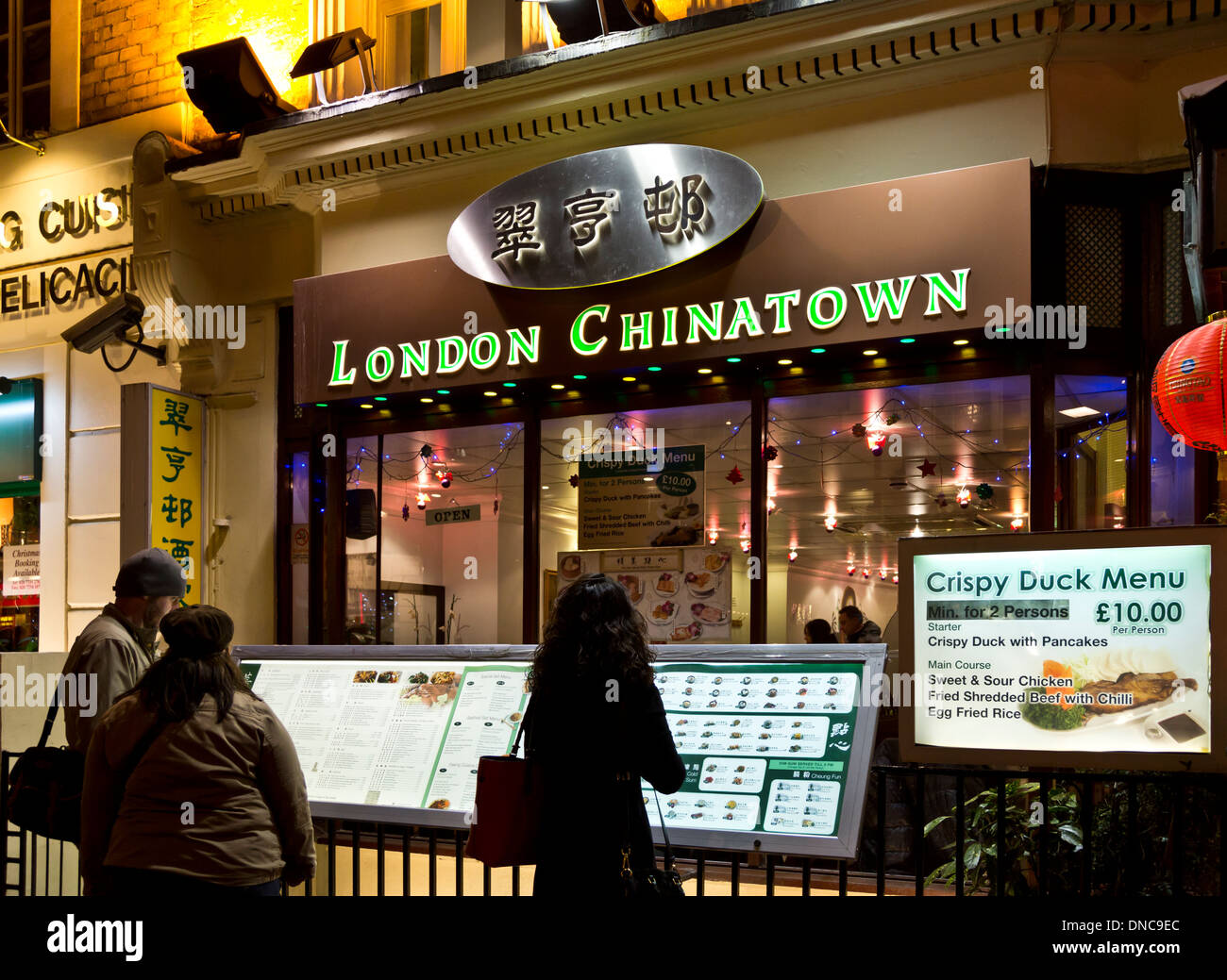 People reading the menu at the London Chinatown Chinese restaurant ...