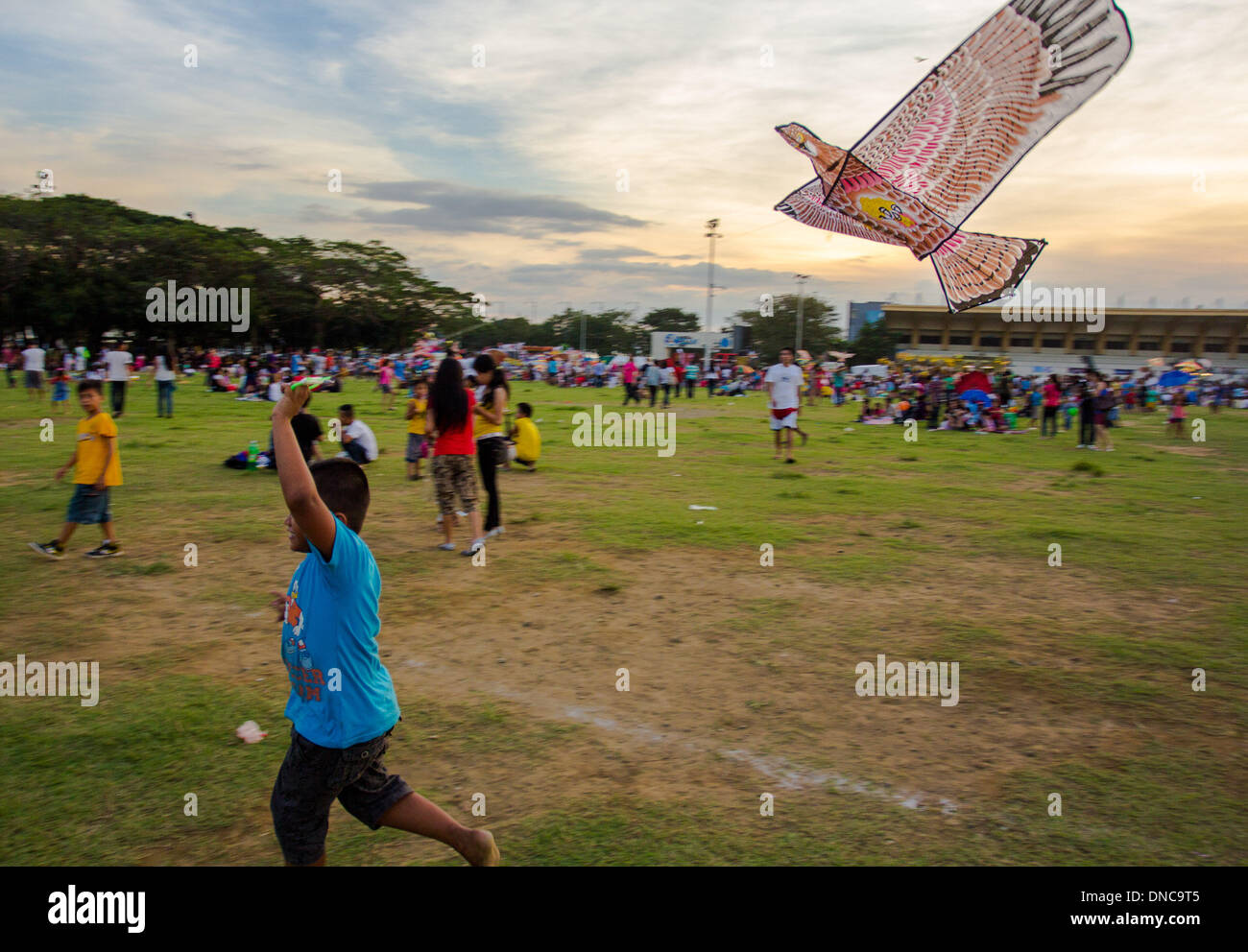 Manila, Philippines. 22nd Dec, 2013. A boy flying his kite in front ...