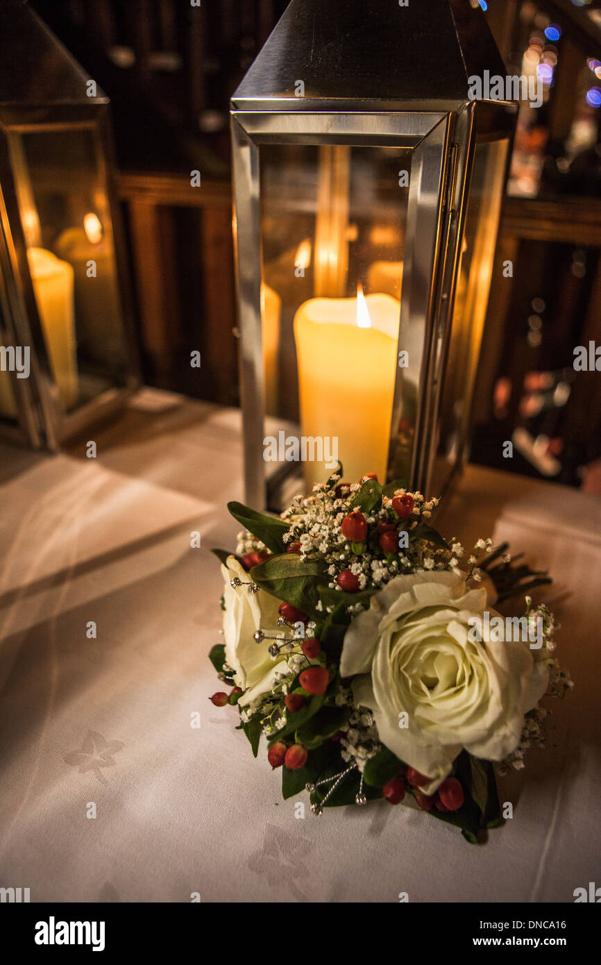 Candle lit lantern with floral decoration Stock Photo - Alamy