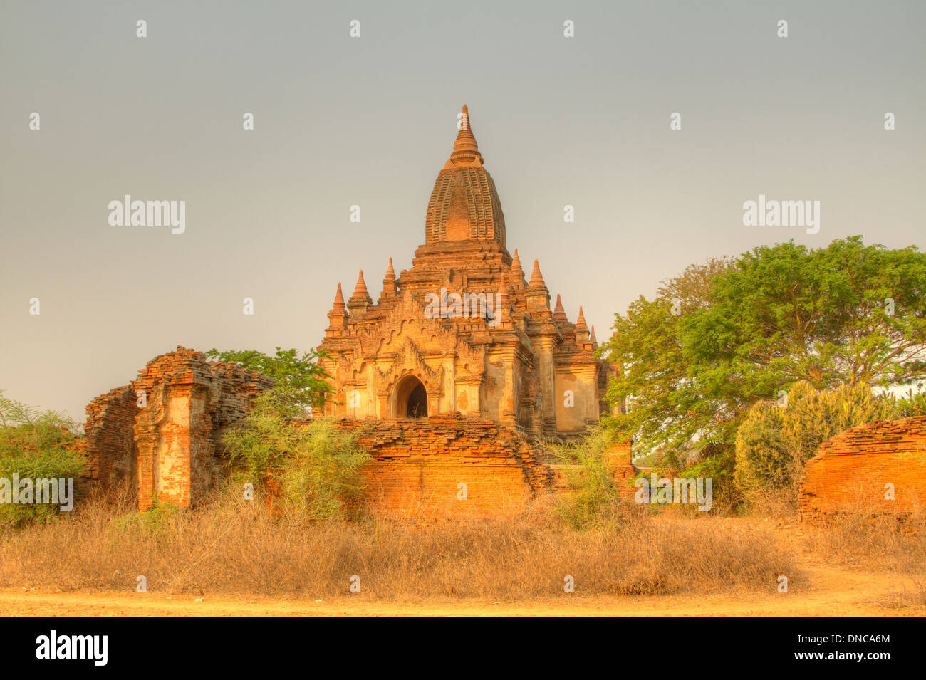 Temple surrounded by collapsing wall Stock Photo - Alamy