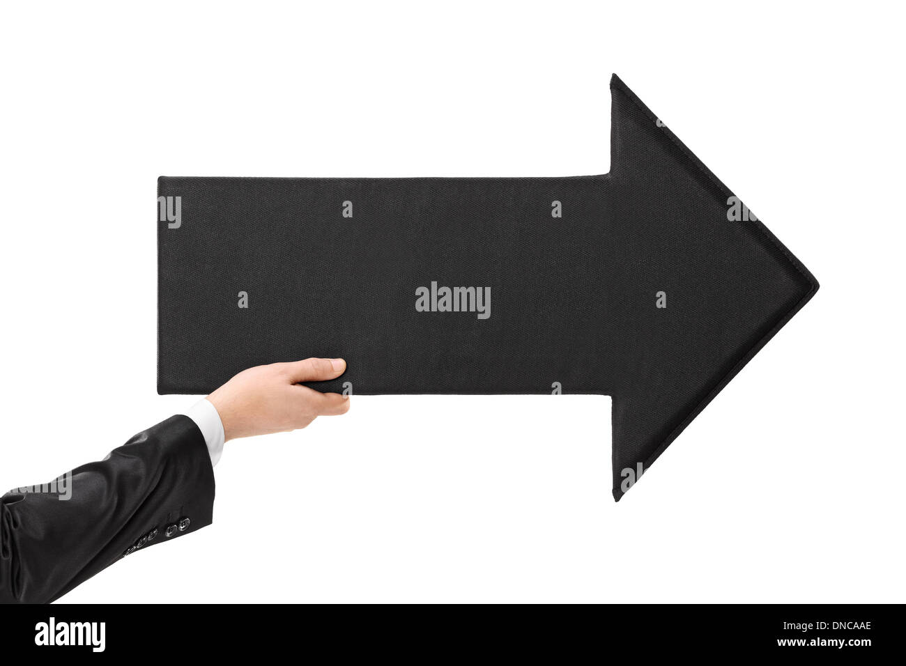 Male hand holding a big black arrow pointing right Stock Photo - Alamy