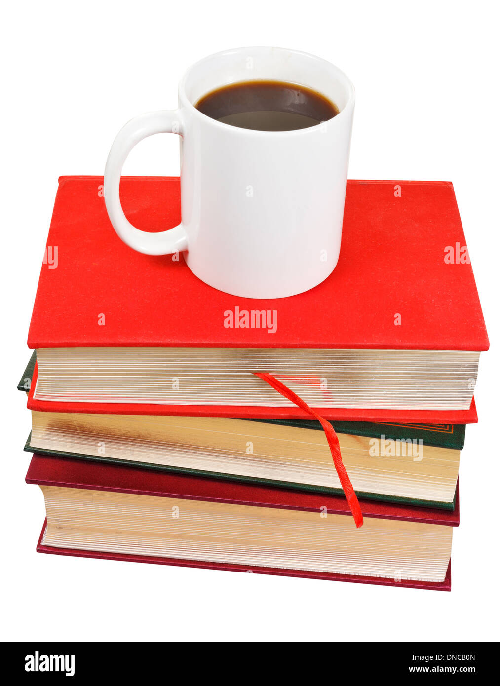 white mug of coffee on stack of books isolated on white background ...