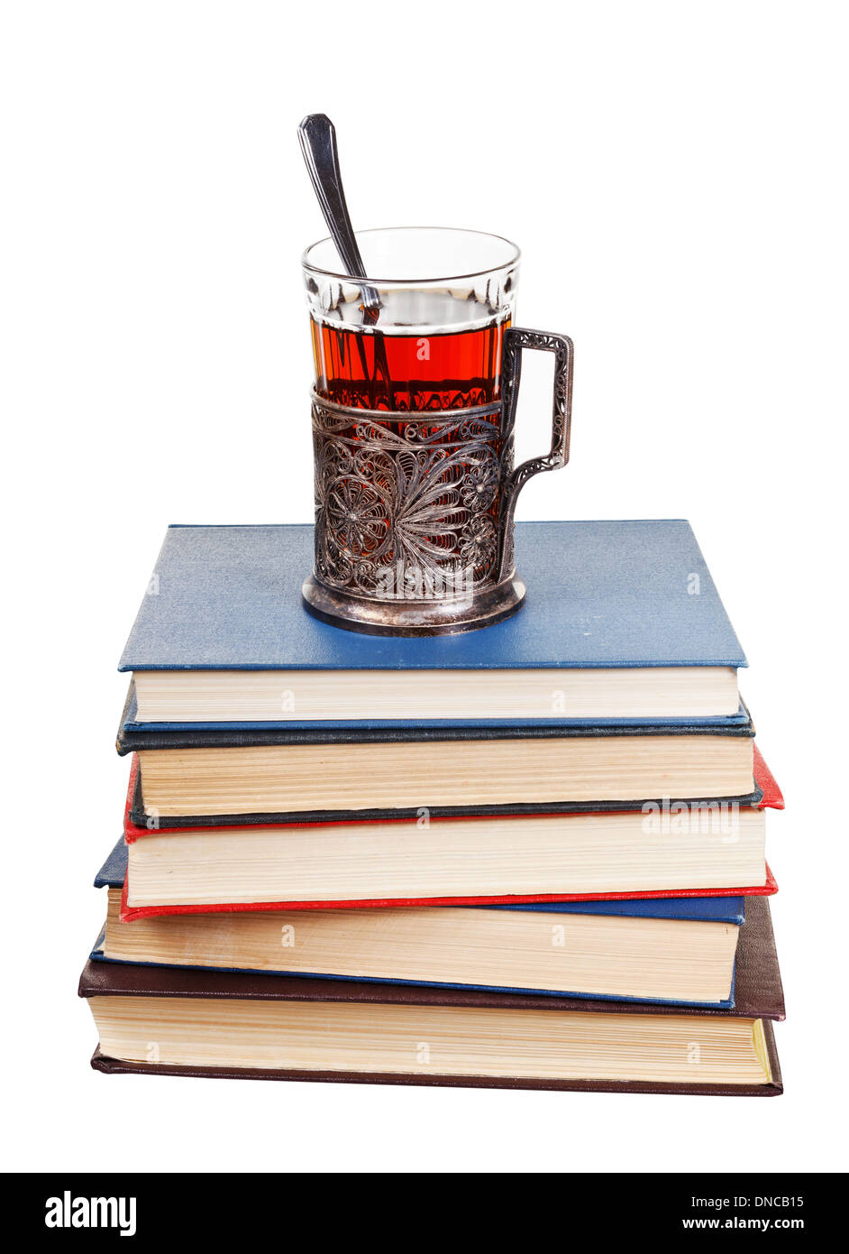 glass of tea on stack of books isolated on white background Stock Photo ...