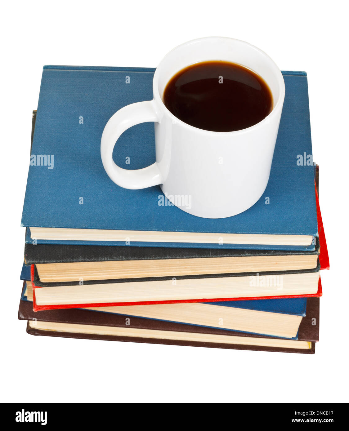 above view mug of coffee on stack of books isolated on white background ...