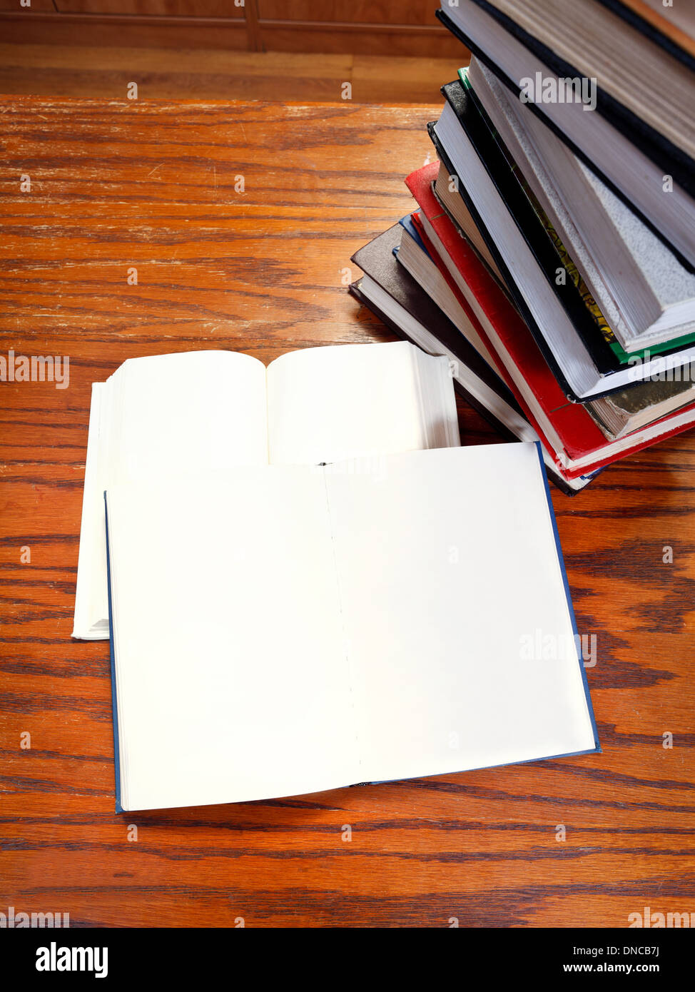 Opened book on top of stack of books hi-res stock photography and ...