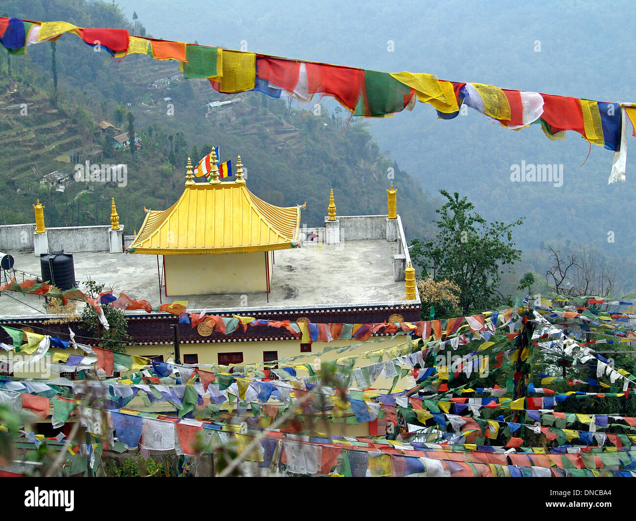 Prayer flags fluttering over a monastery in Gangtok,Sikkim Stock Photo ...