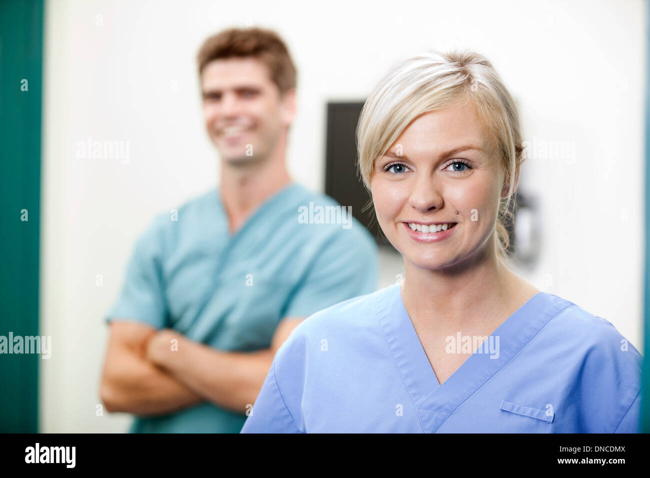 Young Female Vet In Scrubs Smiling Stock Photo - Alamy
