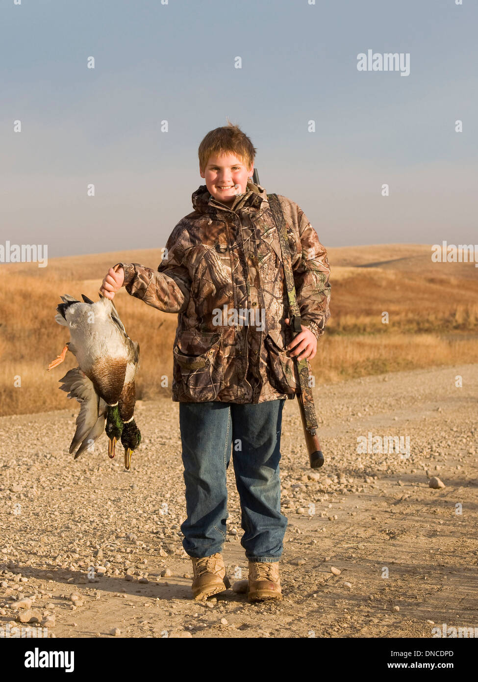 Young Boy hunting ducks Stock Photo - Alamy