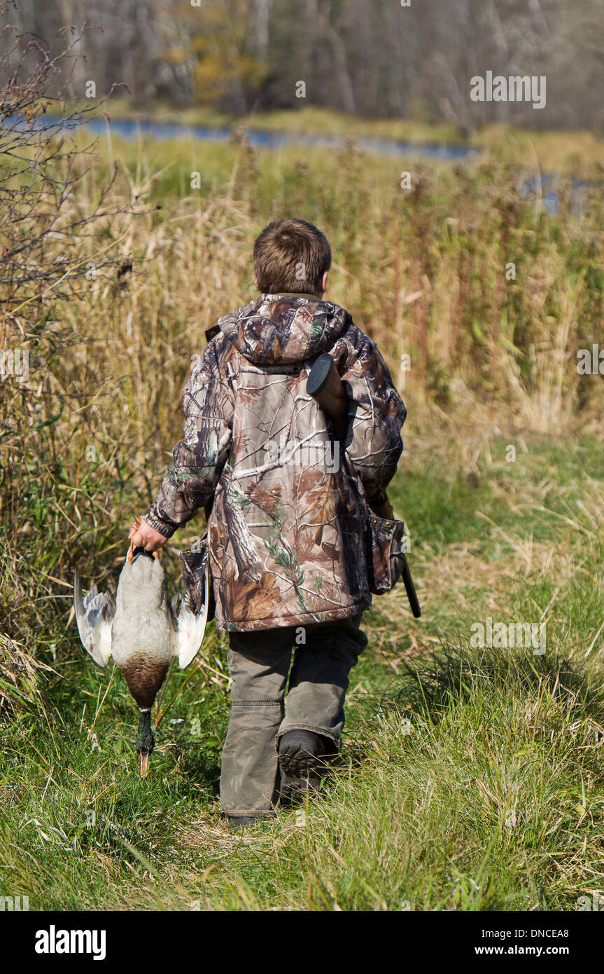 Young Boy hunting ducks Stock Photo - Alamy