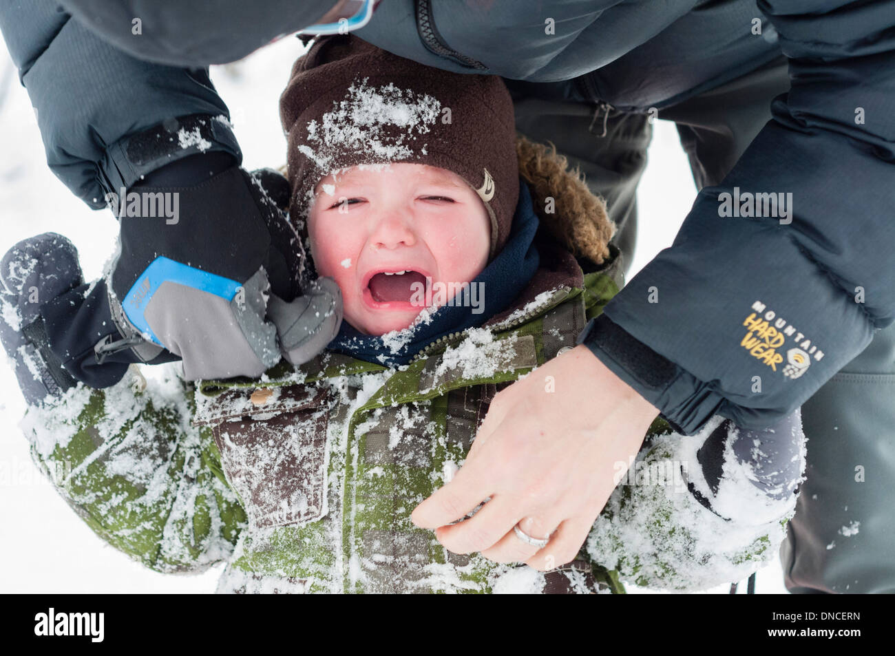 A 20 moth old baby boy crying after falling face first into snow Stock ...