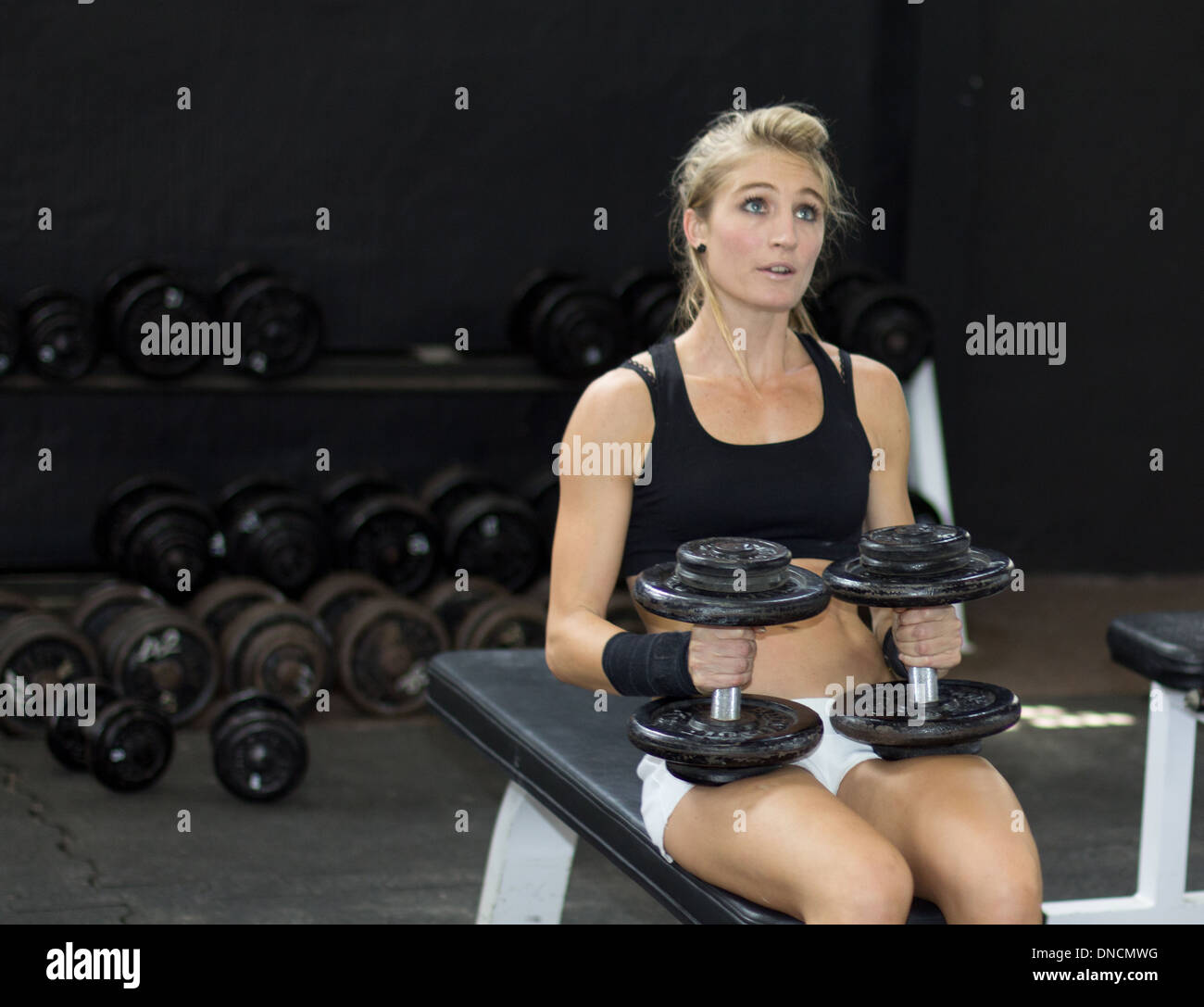 Model working out with weights in the gym Stock Photo - Alamy