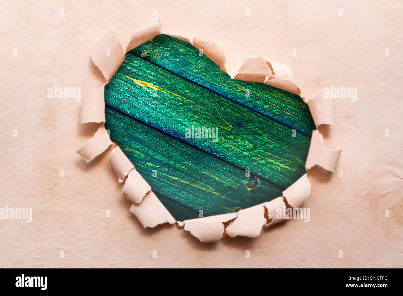 Heart ripped out in the paper and in the middle of desk Stock Photo - Alamy