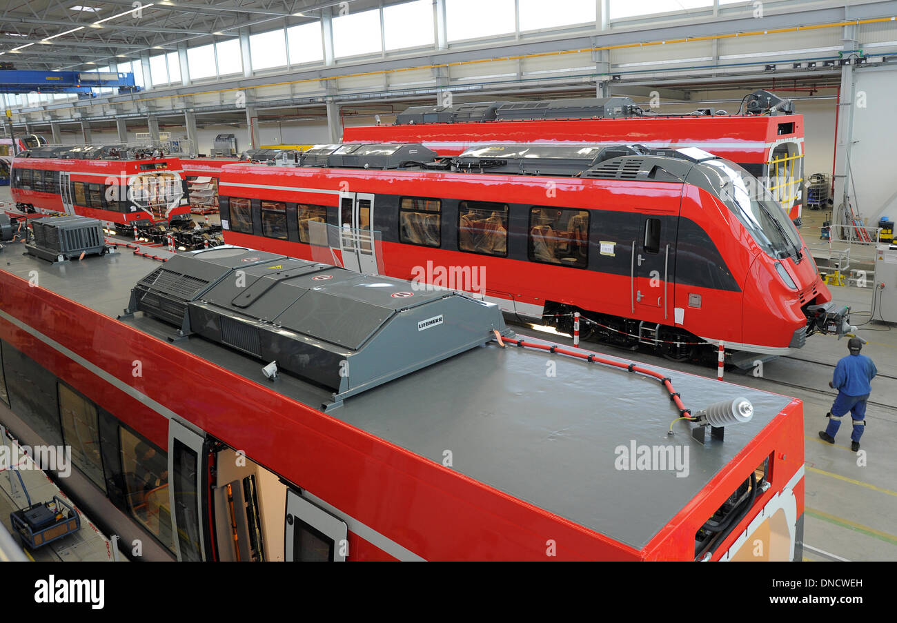 Hennigsdorf, Germany. 18th Dec, 2013. Talent 2 trains are mounted in an ...
