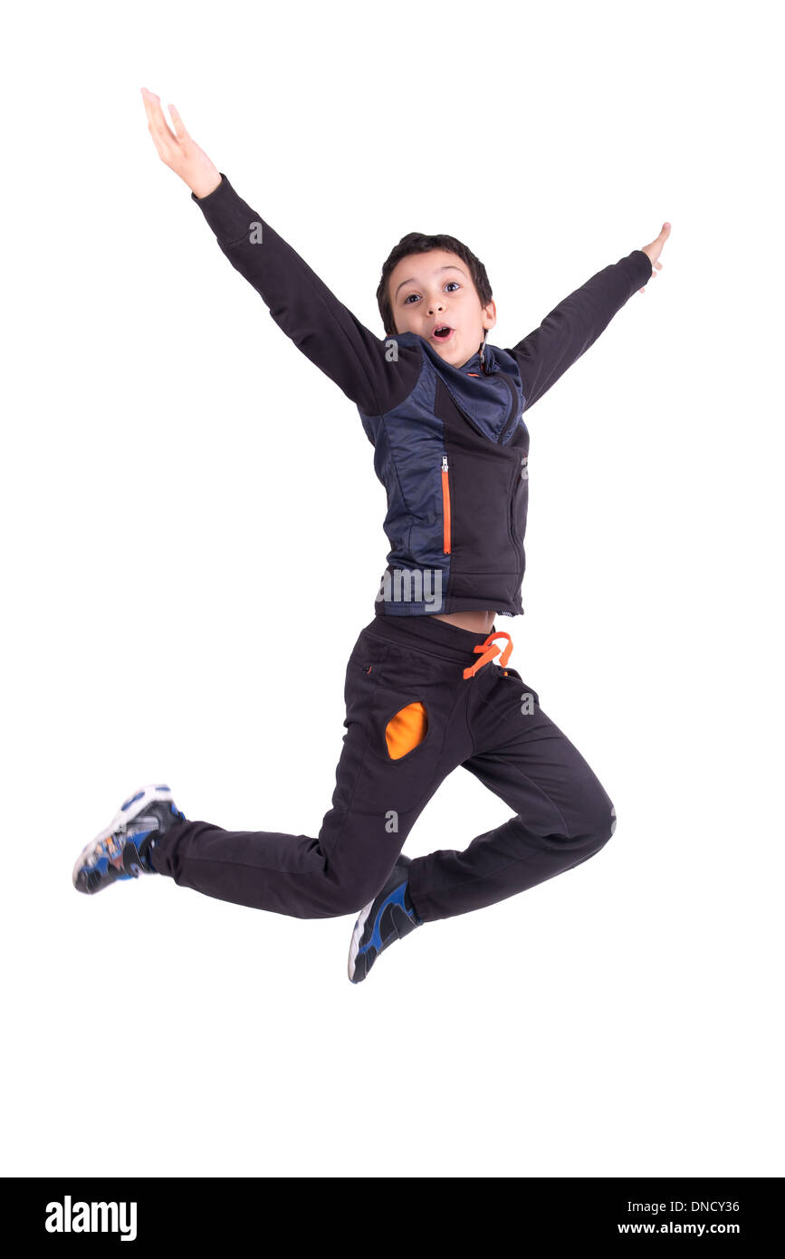 Young boy jumping isolated in white Stock Photo - Alamy