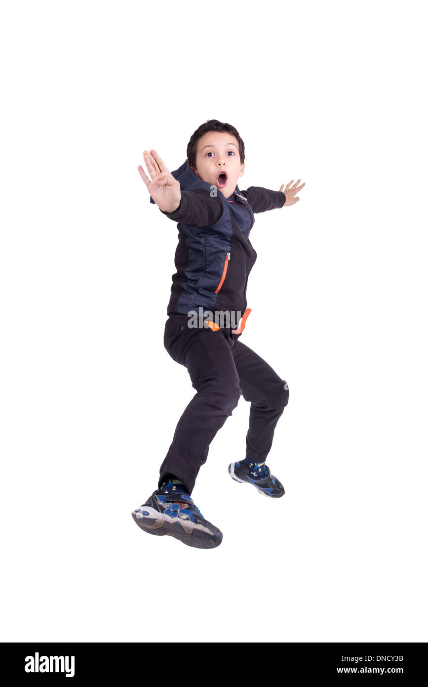 Young boy jumping isolated in white Stock Photo - Alamy