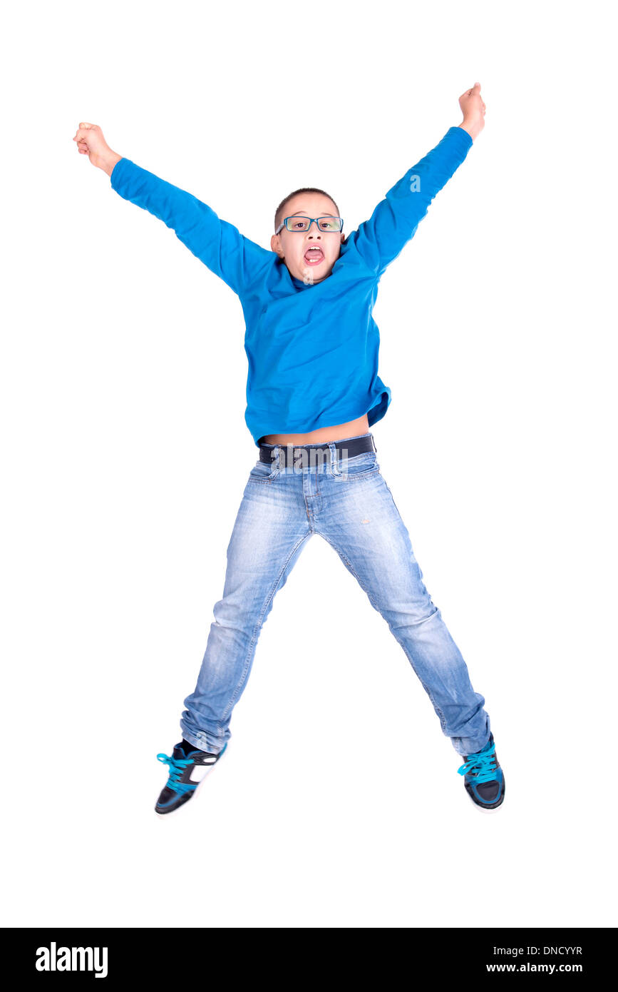 Young boy jumping isolated in white Stock Photo - Alamy