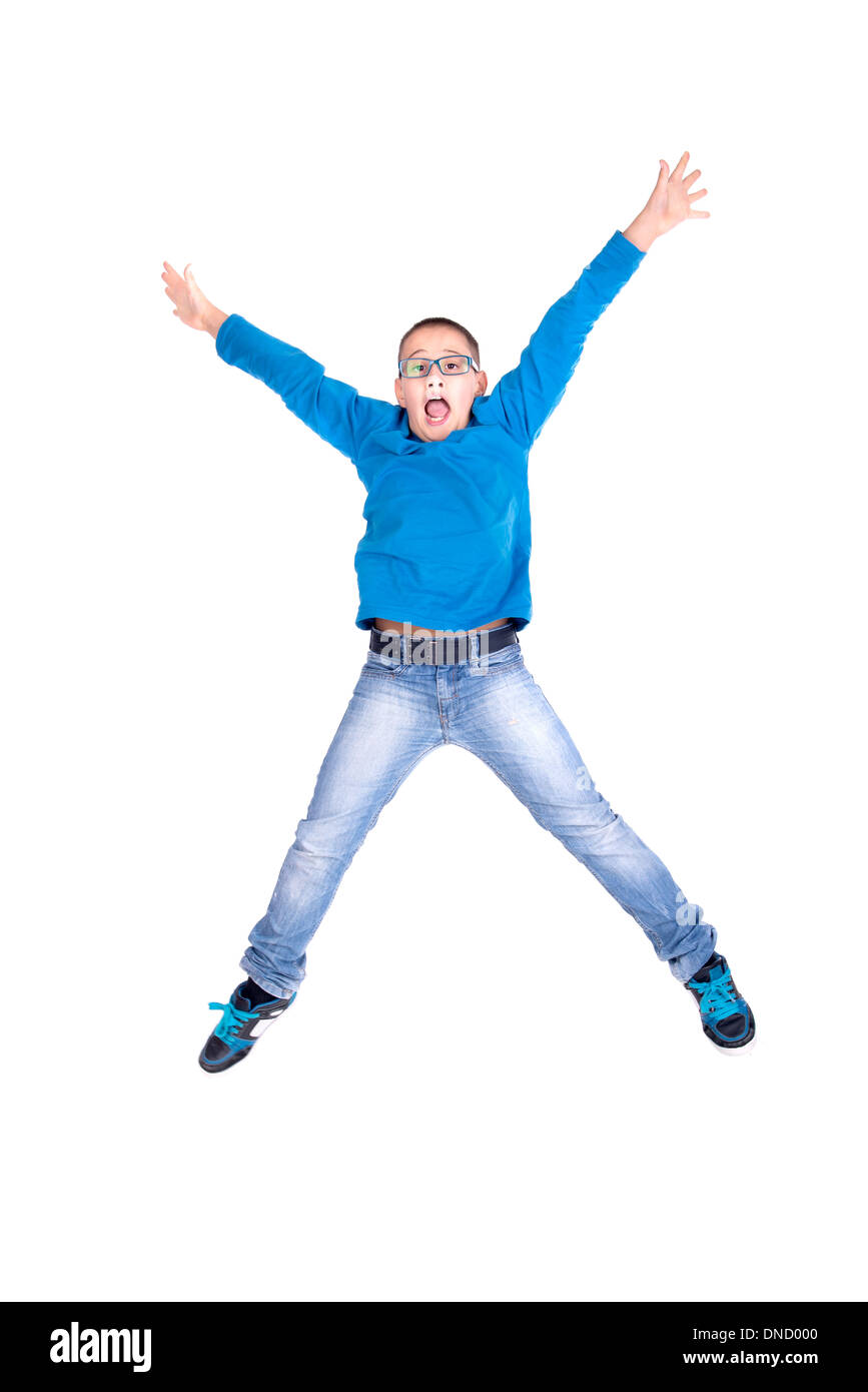 Young boy jumping isolated in white Stock Photo - Alamy