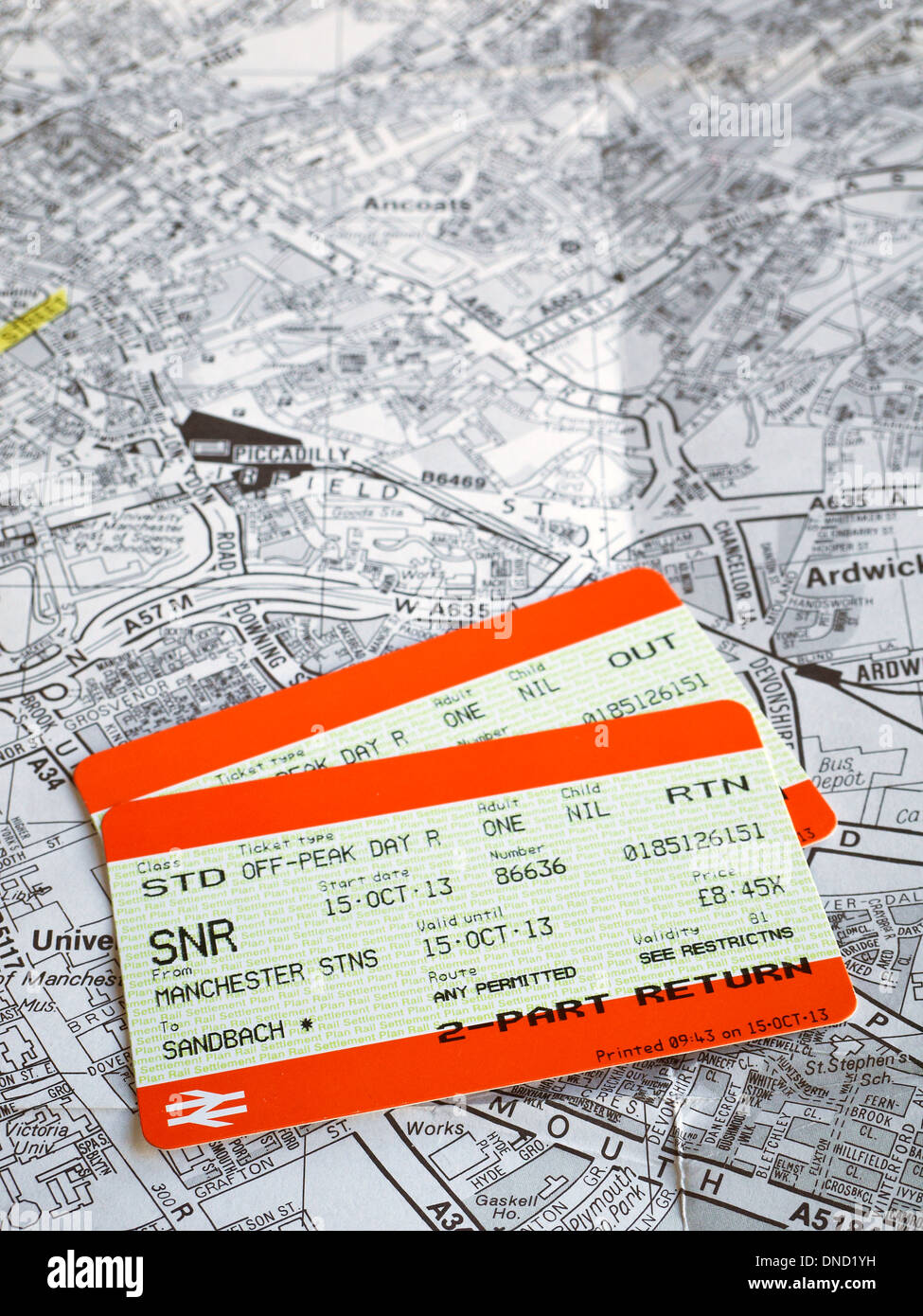 Rail or train tickets on street map uk Stock Photo - Alamy