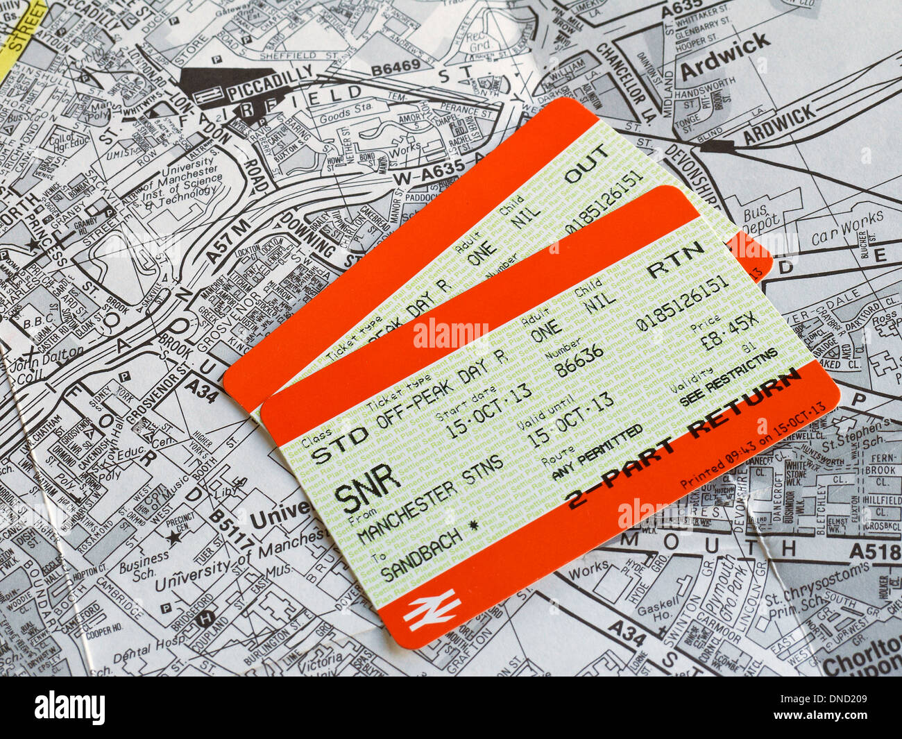 Rail tickets on street map uk Stock Photo - Alamy