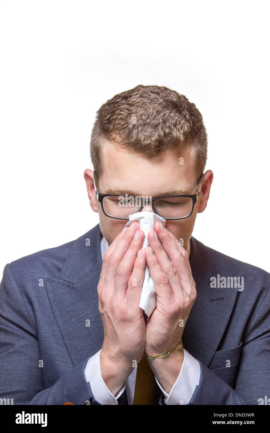 Young business man using a tissue Stock Photo - Alamy