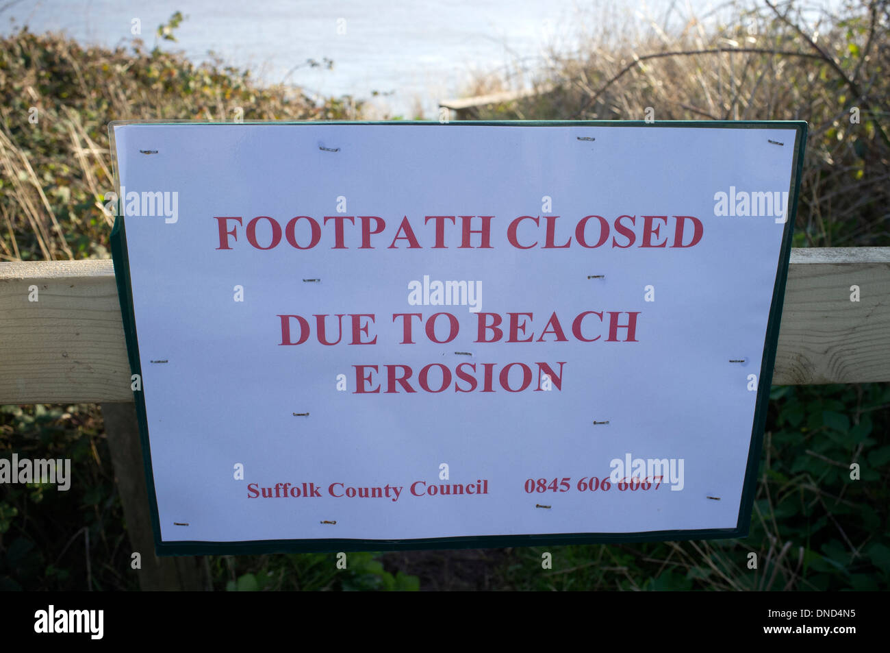 Footpath closed due beach erosion sign Stock Photo - Alamy