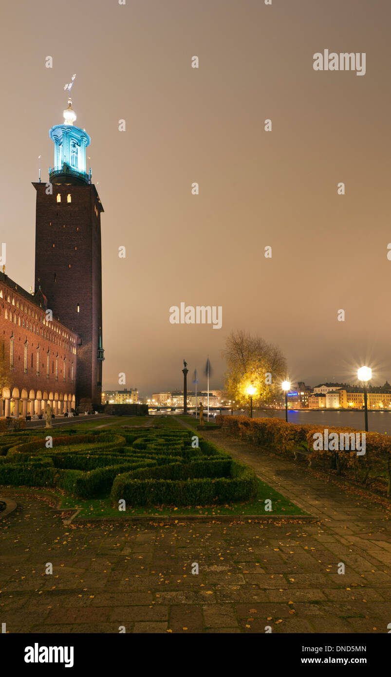 Evening view of Stadshusparken and the monumental tower of Stockholm ...