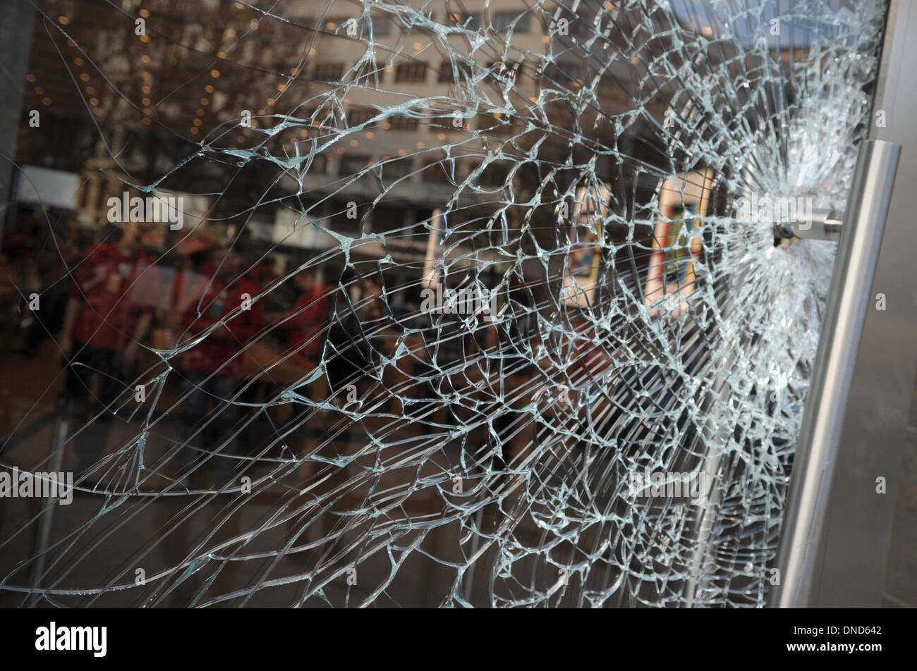 Berlin, Germany. 23rd Dec, 2013. The window is broken at the entrance ...