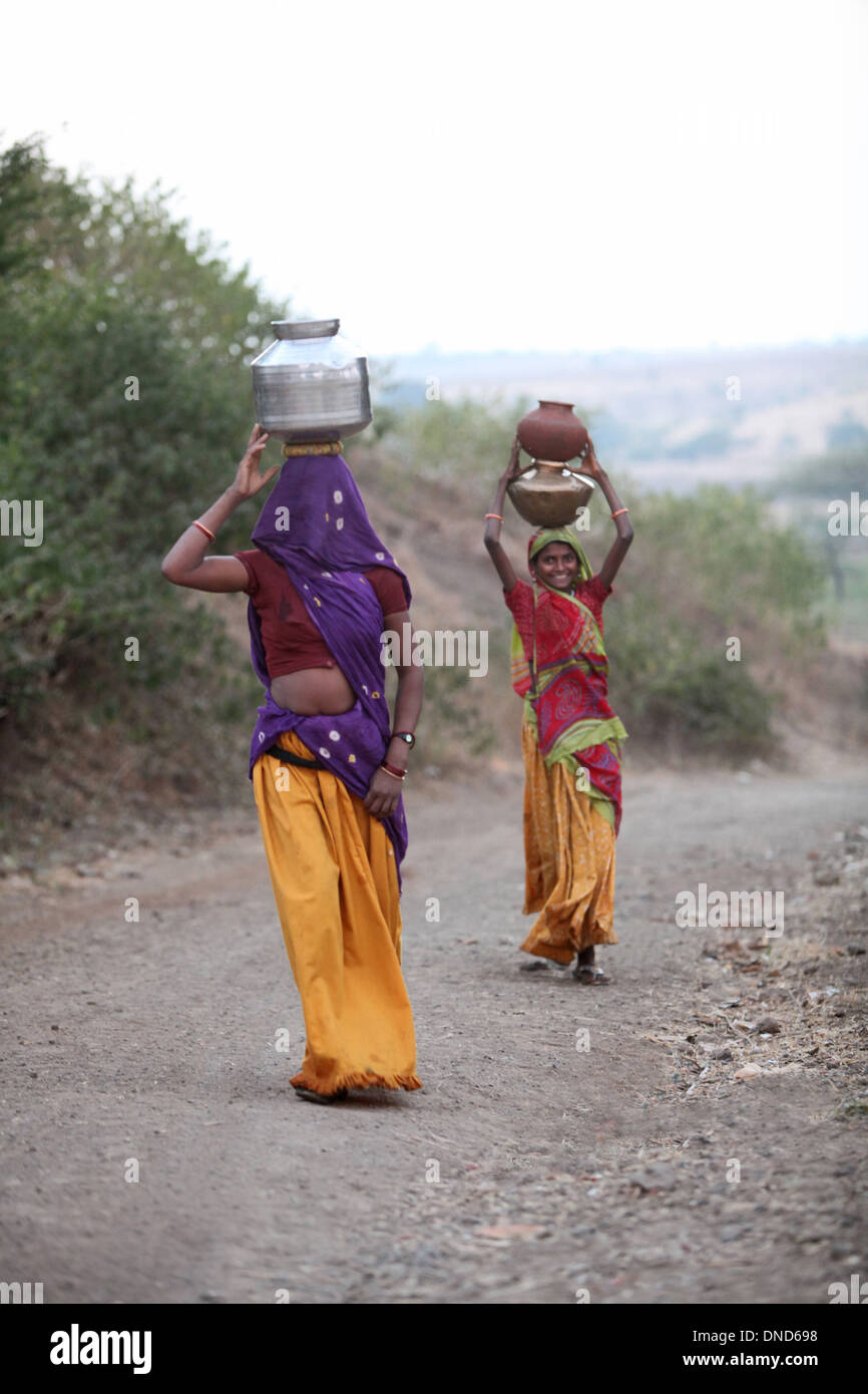 Women carrying water pots, Bhil tribe, Madhya Pradesh, India Stock ...
