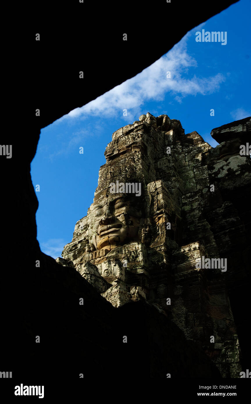 a pillar with a face in the bayon temple, angkor thom, angkor ...