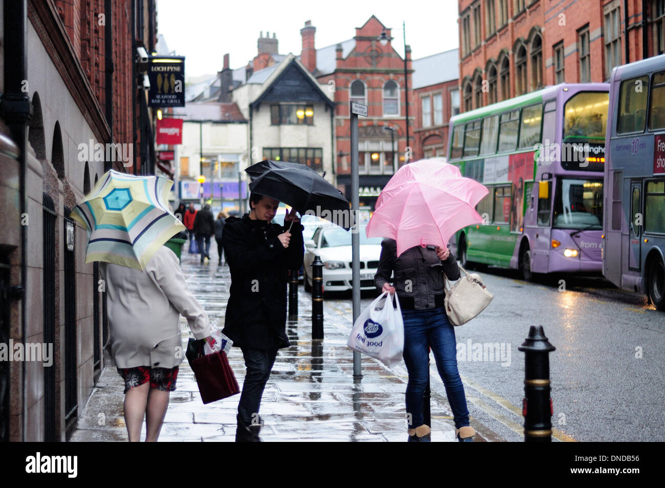 People struggle heavy rain hi-res stock photography and images - Alamy