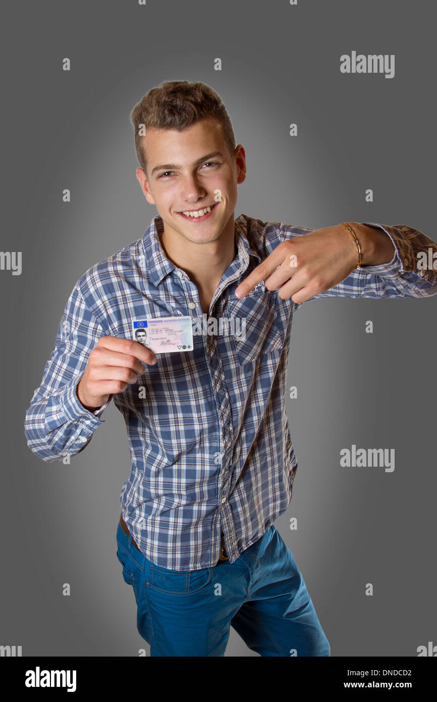 Young man just recieved his drivers license and is happy to drive his ...