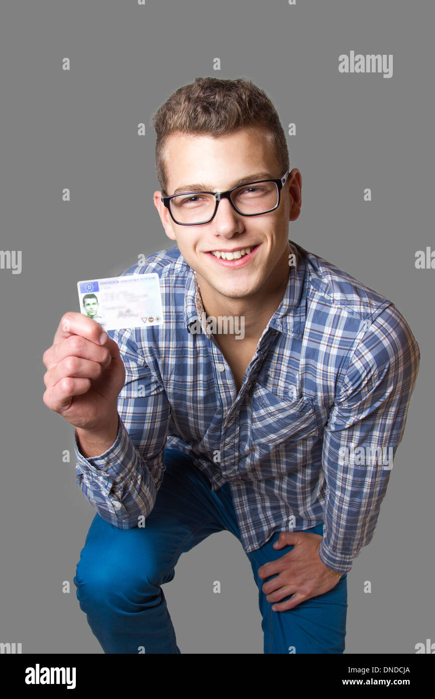 Young man just recieved his drivers license and is happy to drive his ...