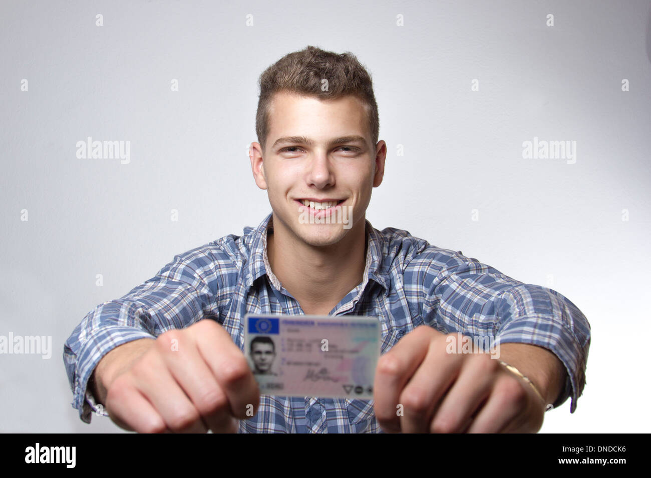 Young man just recieved his drivers license and is happy to drive his ...