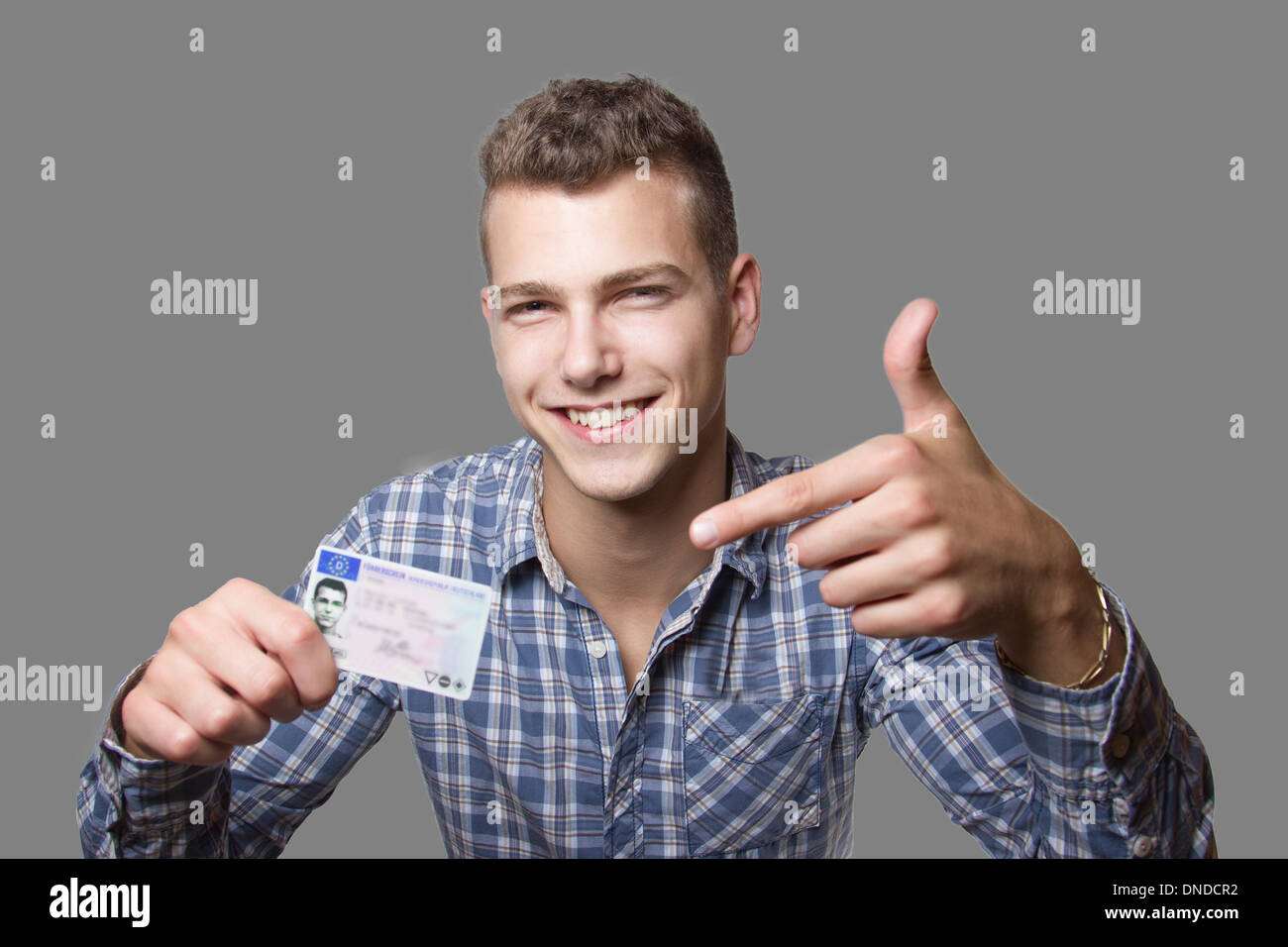 Young man just recieved his drivers license and is happy to drive his ...