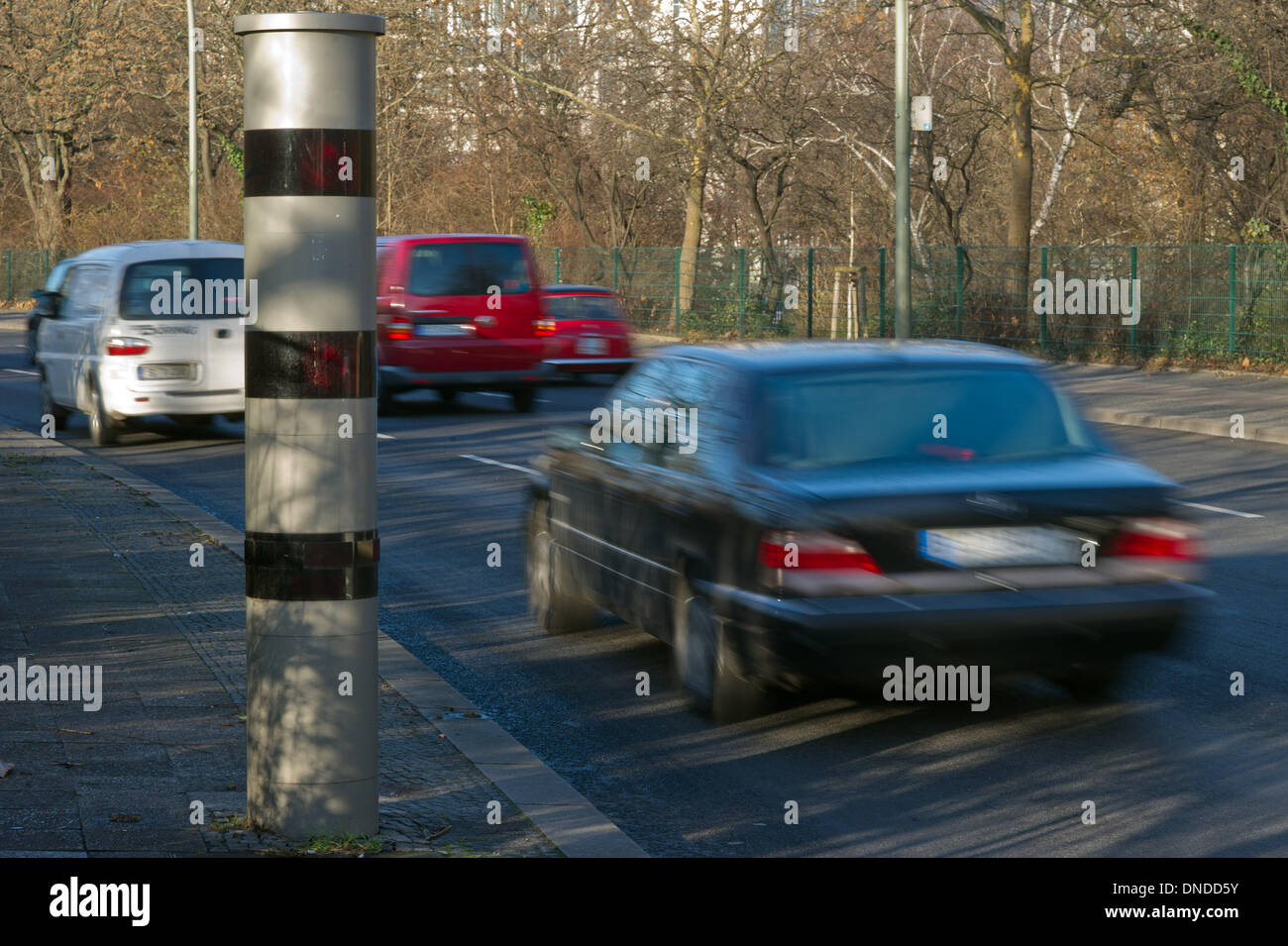 Berlin, Germany. 23rd Dec, 2013. Cars drive past a speed camera column ...