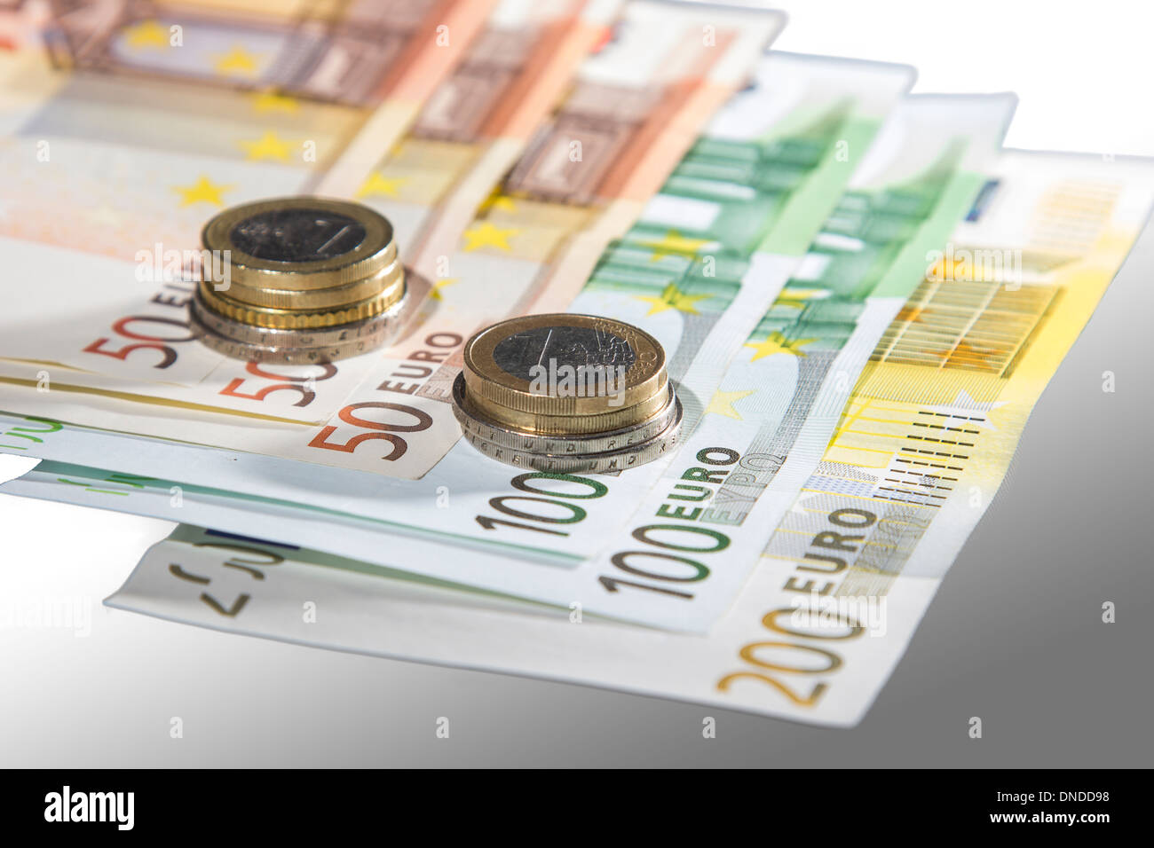 200, 100 and 50 Euro banknotes with coinstacks on it Stock Photo - Alamy