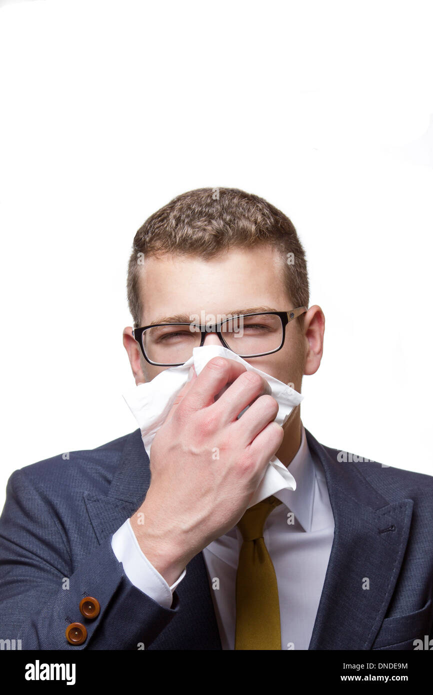 Young business man using a tissue Stock Photo - Alamy