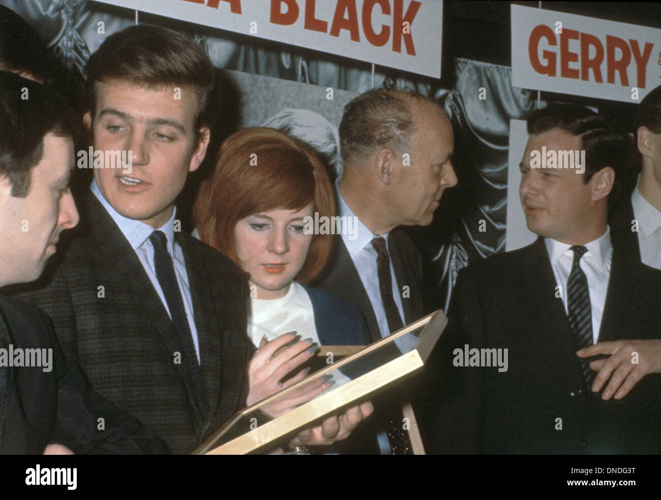 BRIAN EPSTEIN at right with Billy J. Kramer and Cilla Black, talks to ...