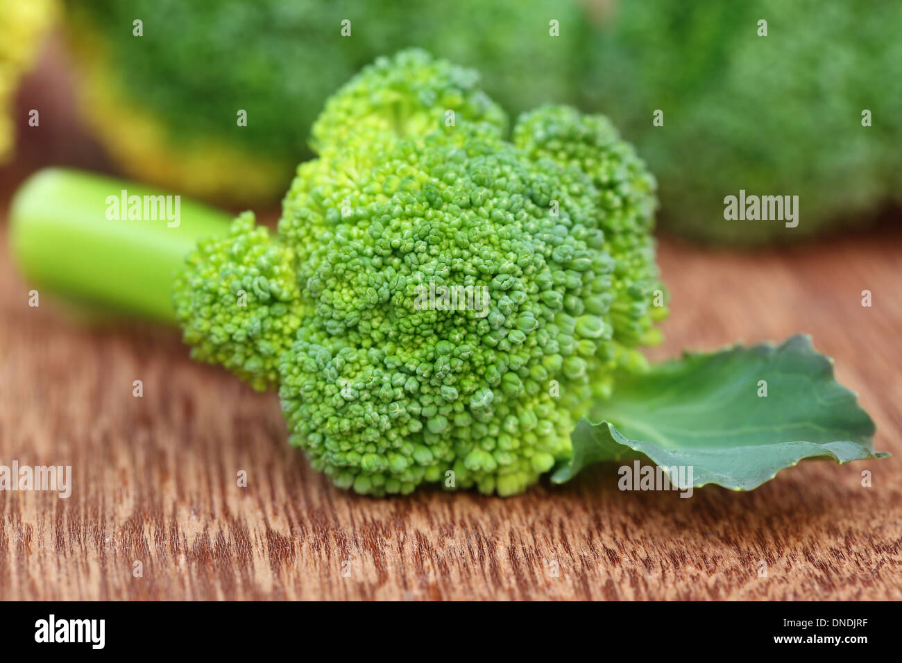 Fresh Broccoli with leaf over wooden surface Stock Photo - Alamy