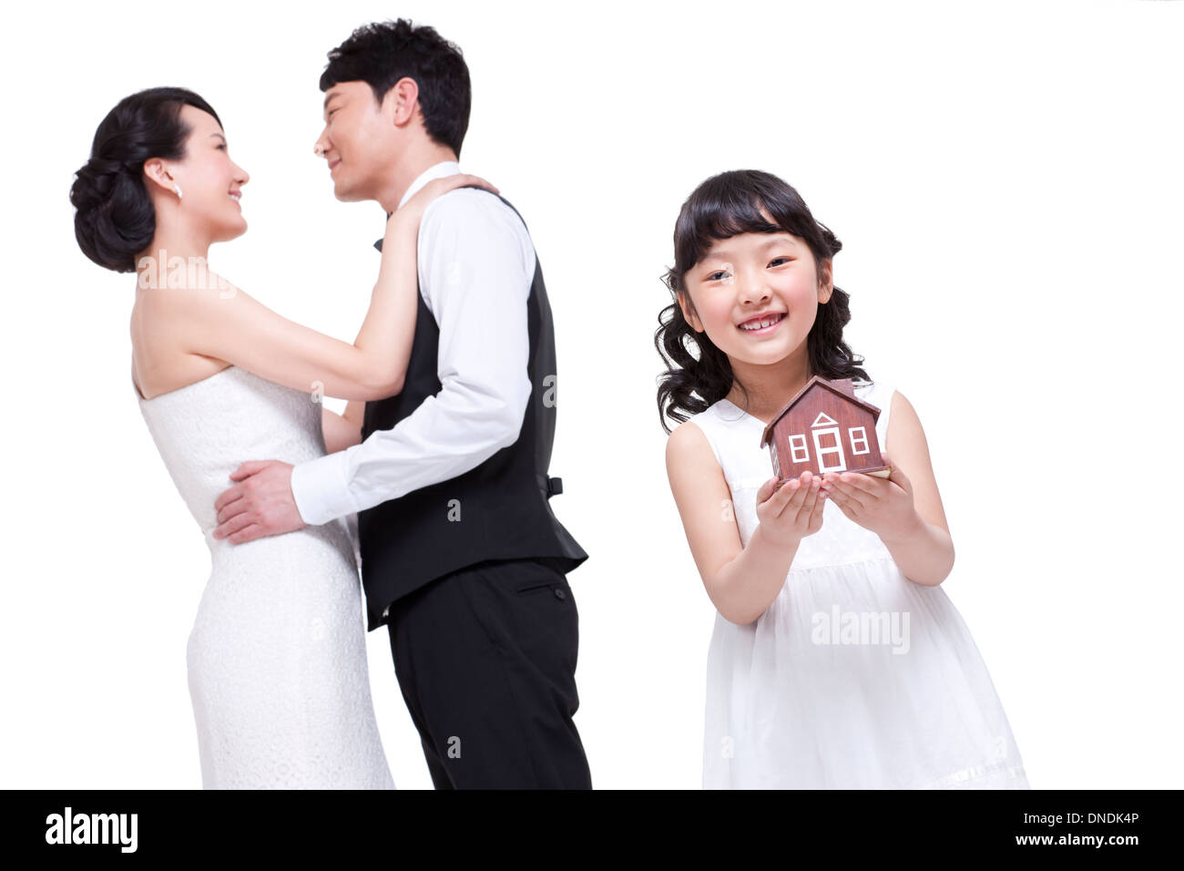 Elegant family with house model Stock Photo - Alamy