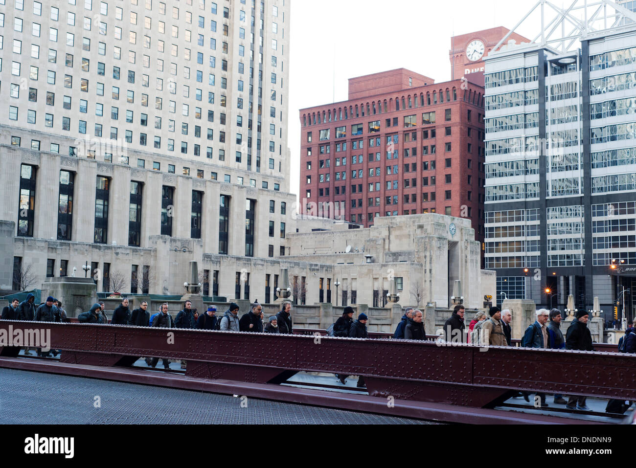 Chicago office workers cross the Chicago River from the Ogilvie ...