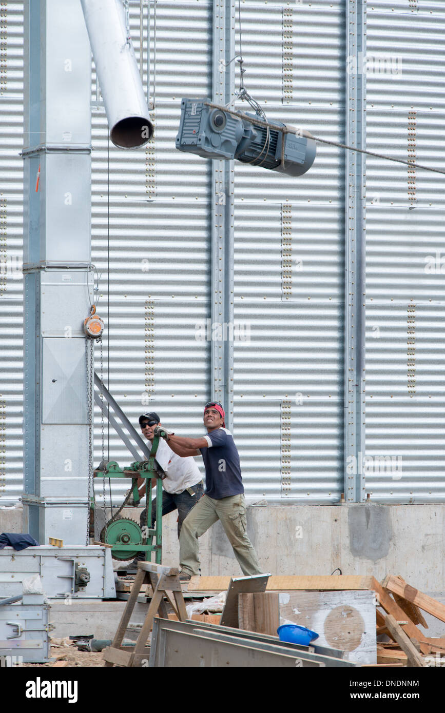 Workers at Silo Base Stock Photo - Alamy