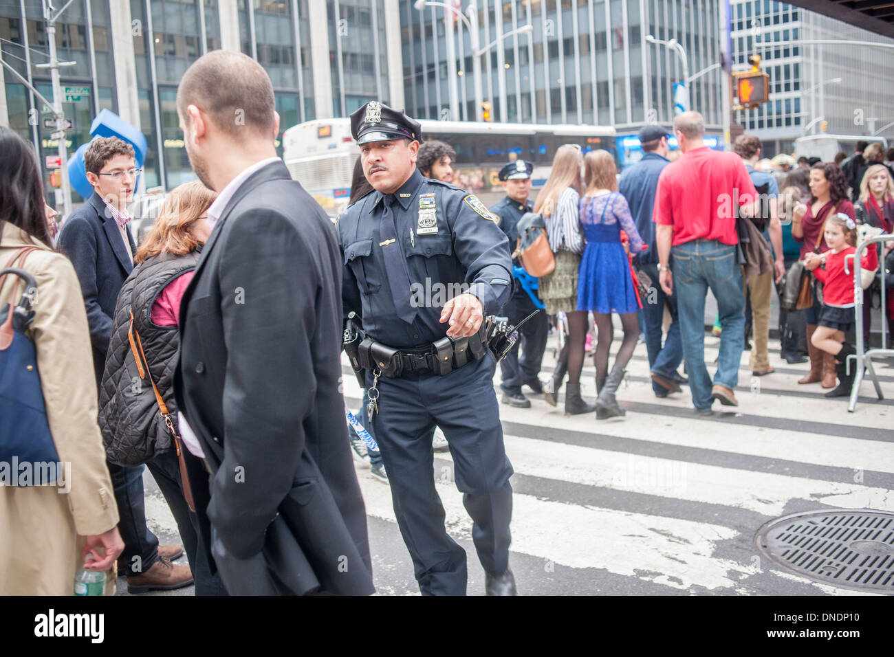 NYPD officers use police tape and barricades to control the hordes of ...