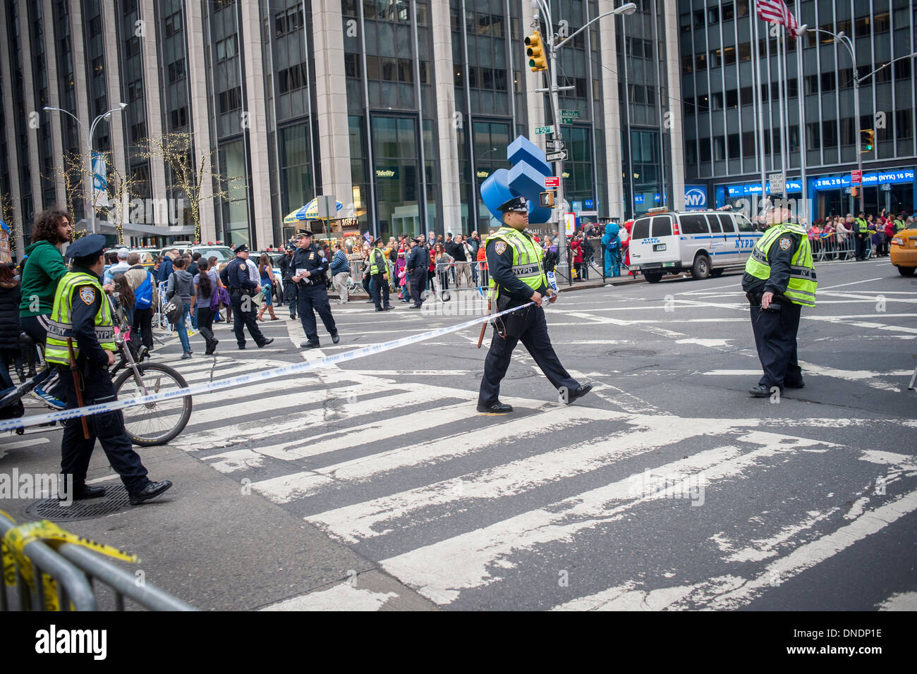 NYPD officers use police tape and barricades to control the hordes of ...
