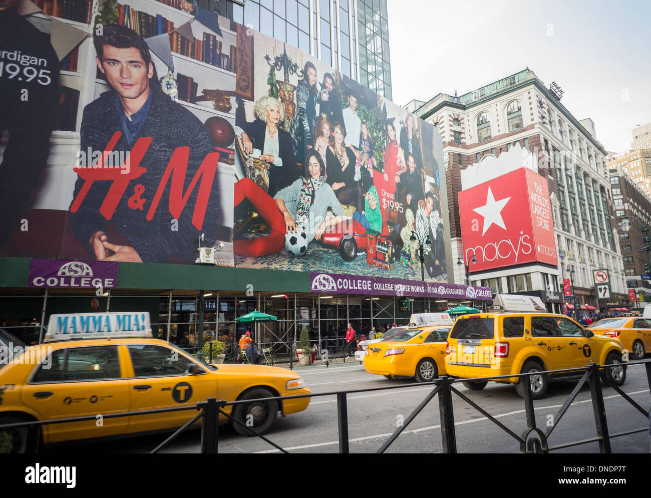 An enormous billboard announces the future arrival of an H&M department ...