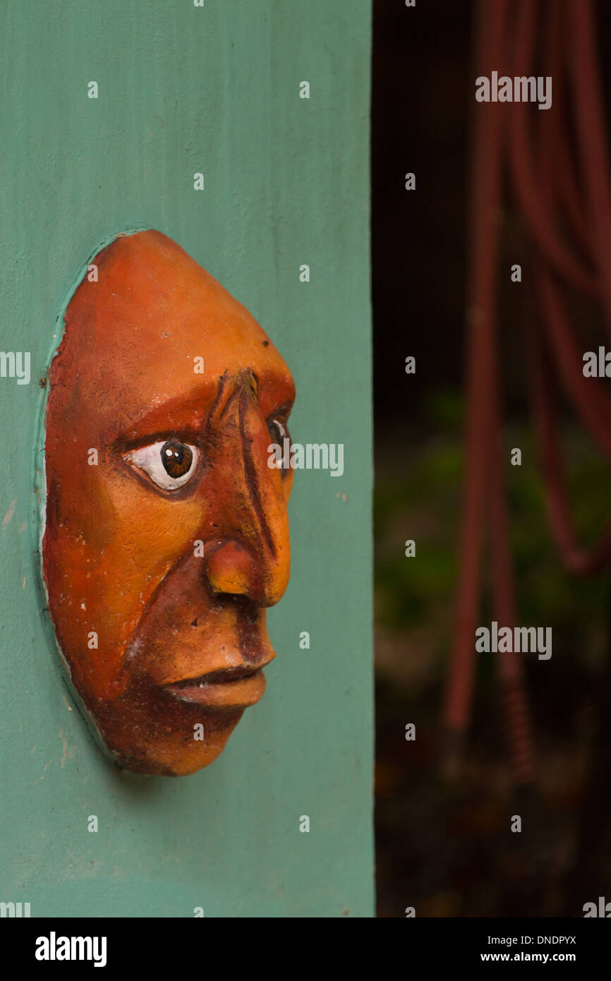 Mayan face in concrete on a wall in belize Stock Photo - Alamy