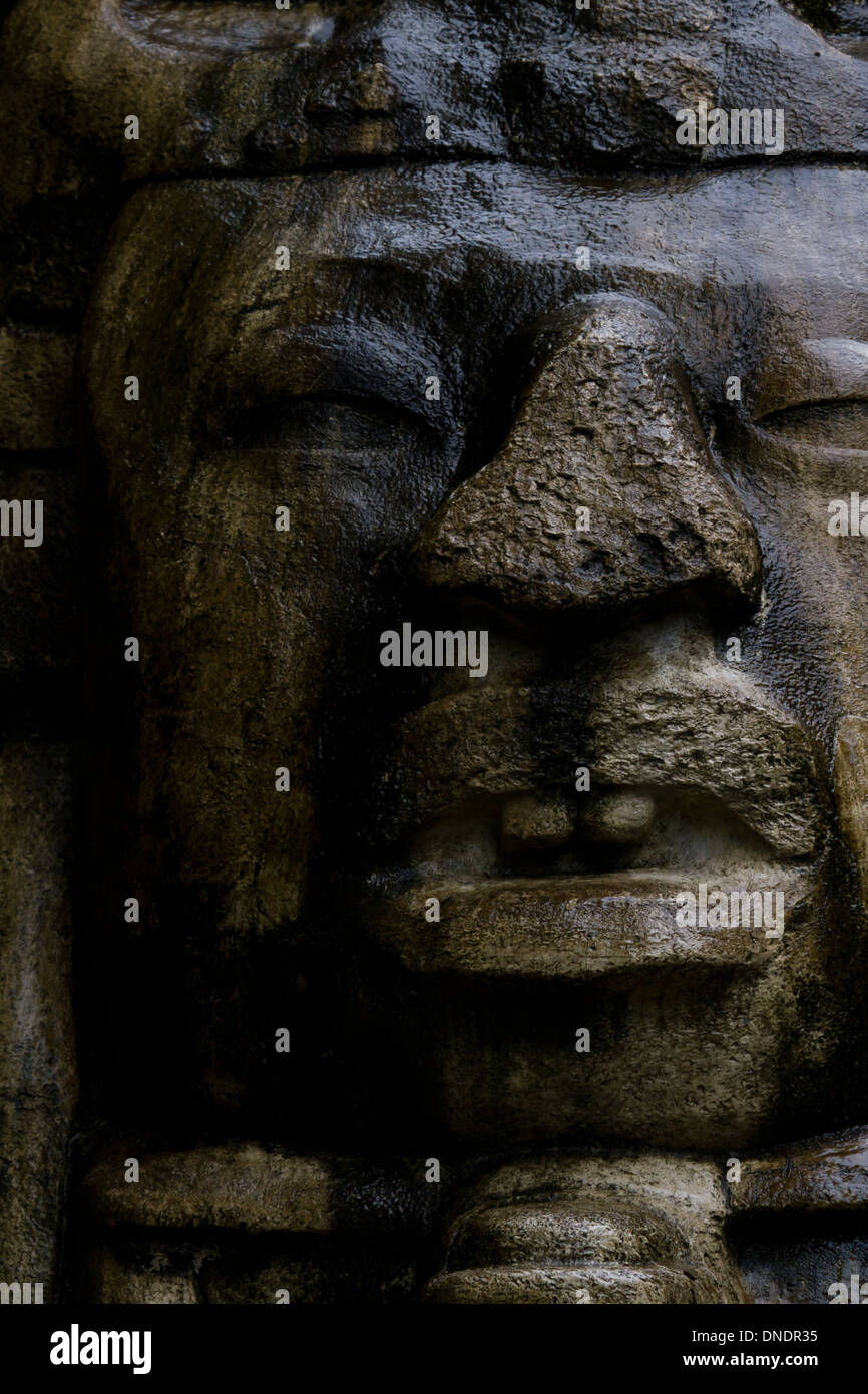 close up of a large rock face on the Mask Temple in Lamanai Belize ...