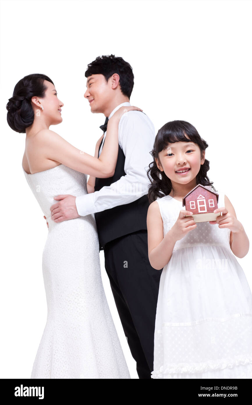 Elegant family with house model Stock Photo - Alamy