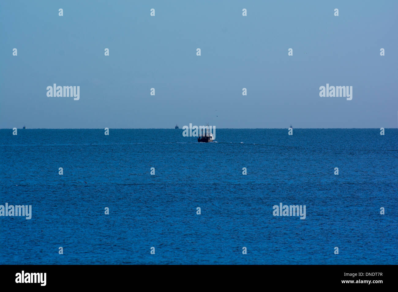 Boat at the horizon hi-res stock photography and images - Alamy