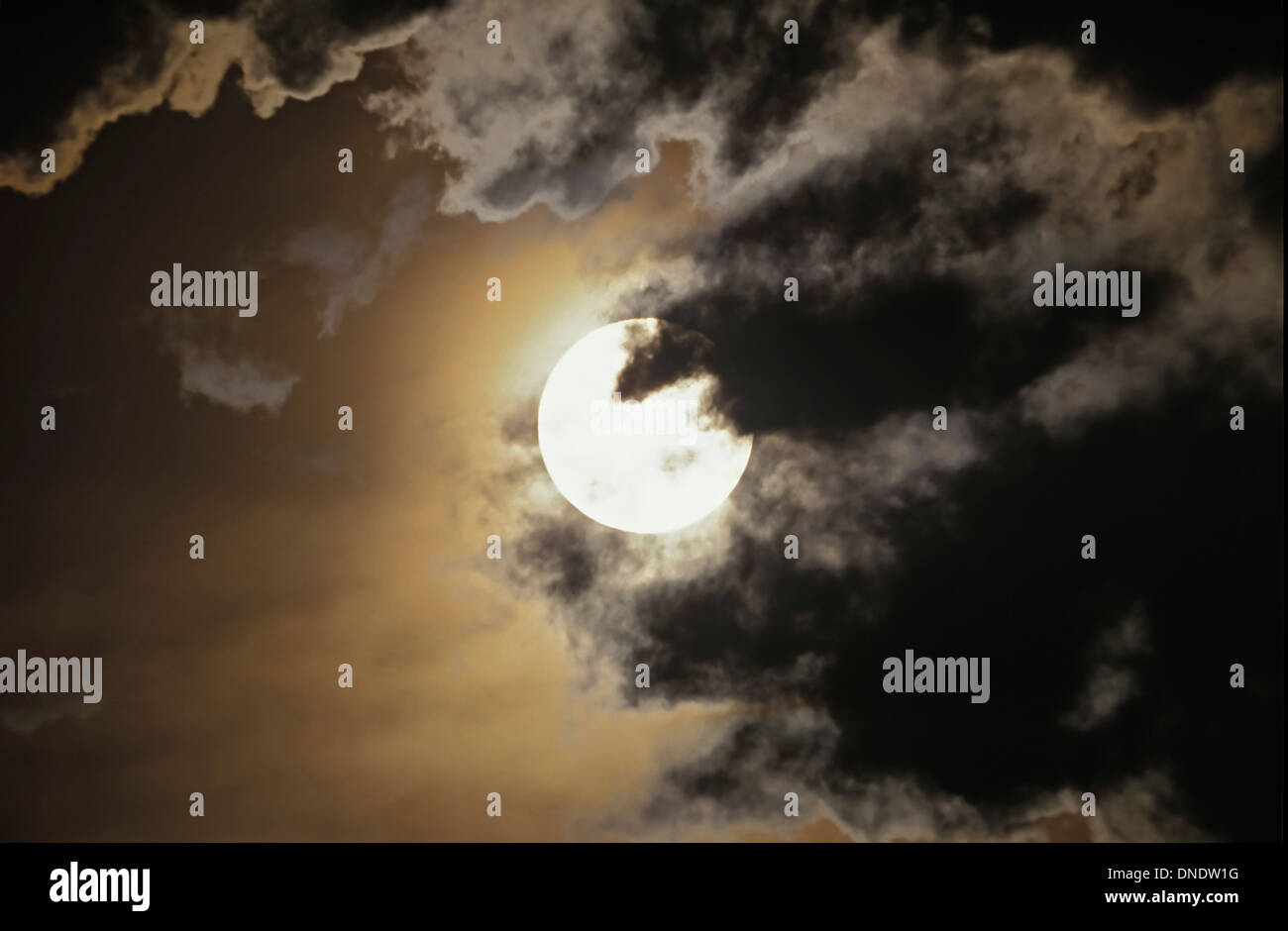 January 9, 2001- Full moon in clouds, Gleichen, Alberta, Canada Stock ...